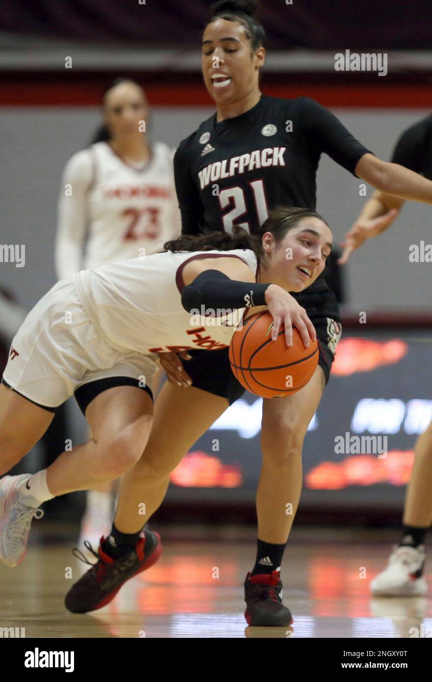 Virginia Tech's Georgia Amoore (5) drives around North Carolina State's ...
