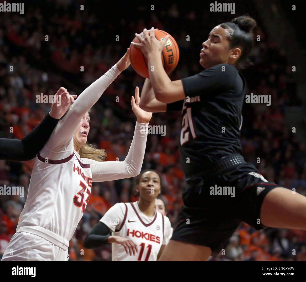 North Carolina State's Madison Hayes, right, grabs an offensive rebound ...