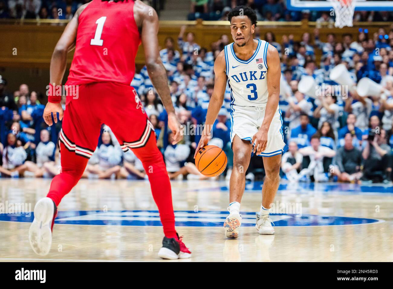 Duke guard Jeremy Roach (3) brings the ball upcourt while guarded by Louisville guard Mike James ...