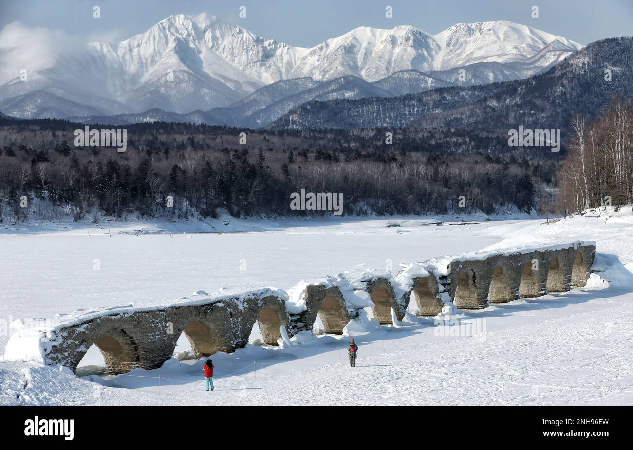 The "Taushubetsu River Bridge" appears over frozen Lake Nukabira in ...