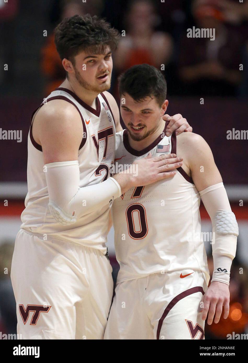 Virginia Tech's Grant Basile (21) left, and Virginia Tech's Hunter ...
