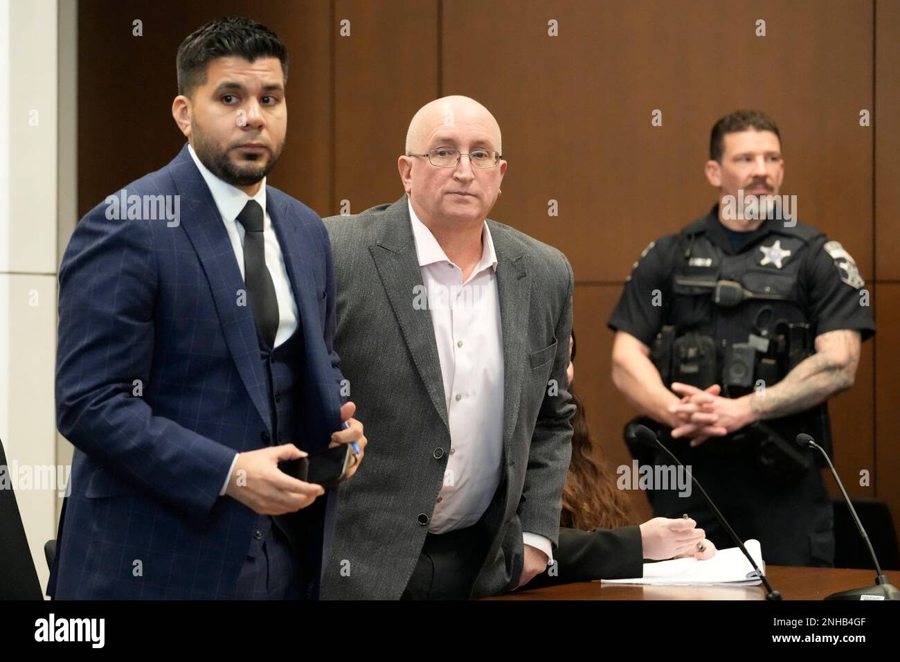 Robert E. Crimo Jr., center, father of Robert Crimo III, and his ...