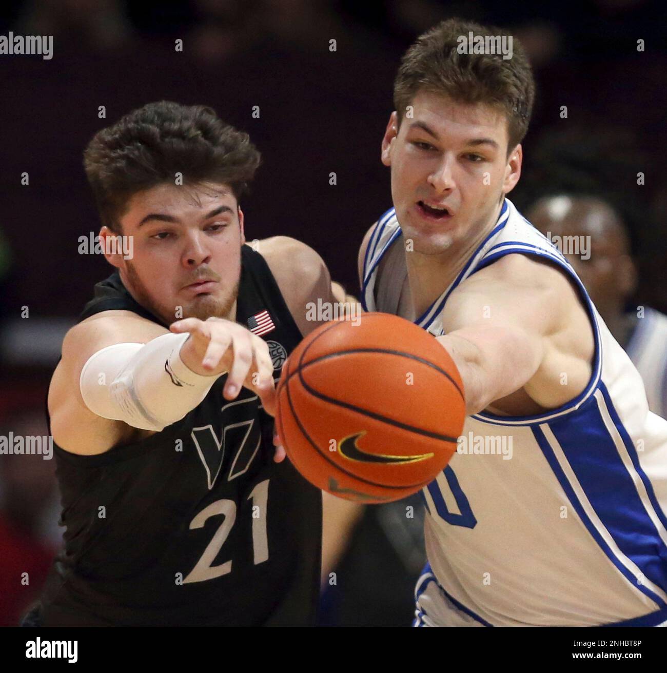 Virginia Tech's Grant Basile (21) left, and Duke's Kyle Filipowski (30 ...