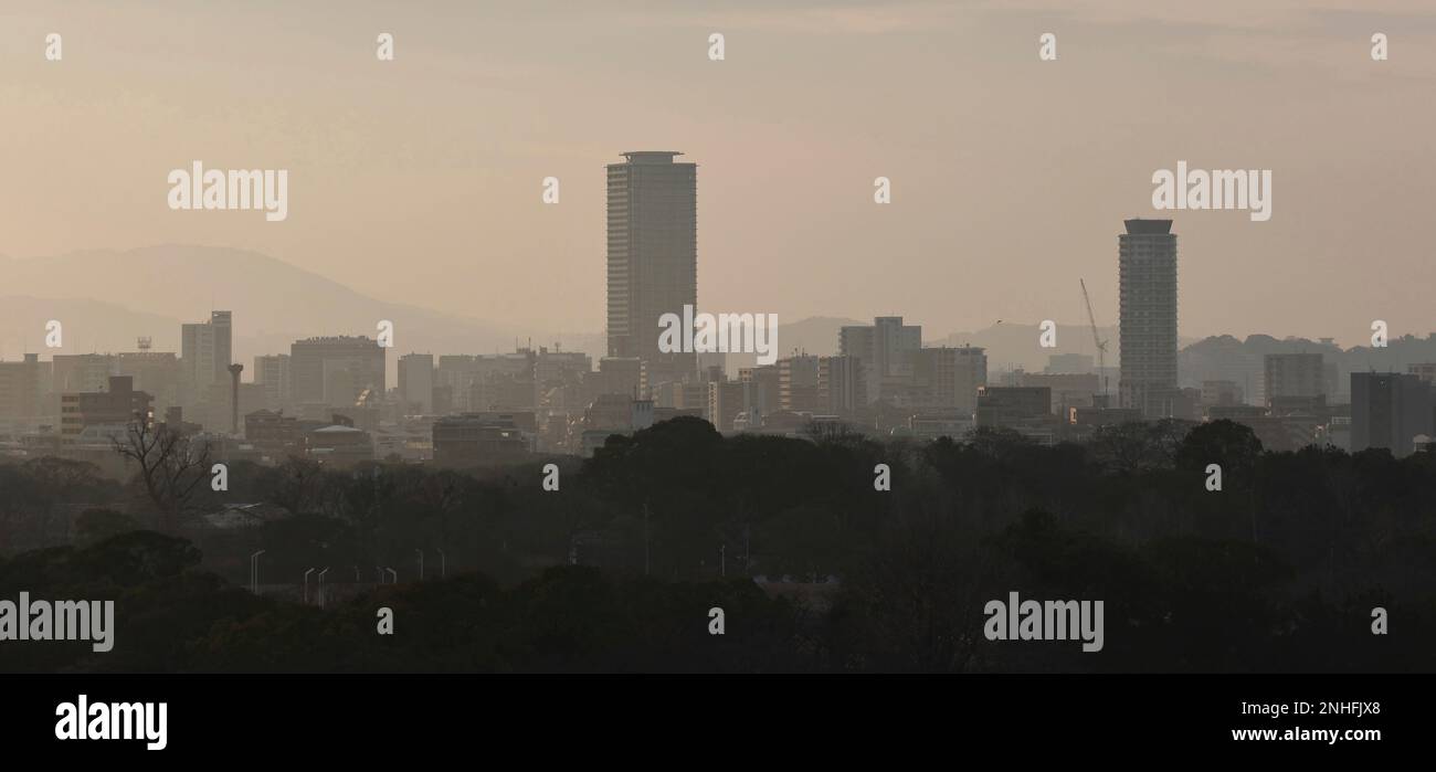 A photo shows yellow sand and air pollution covering the city of ...