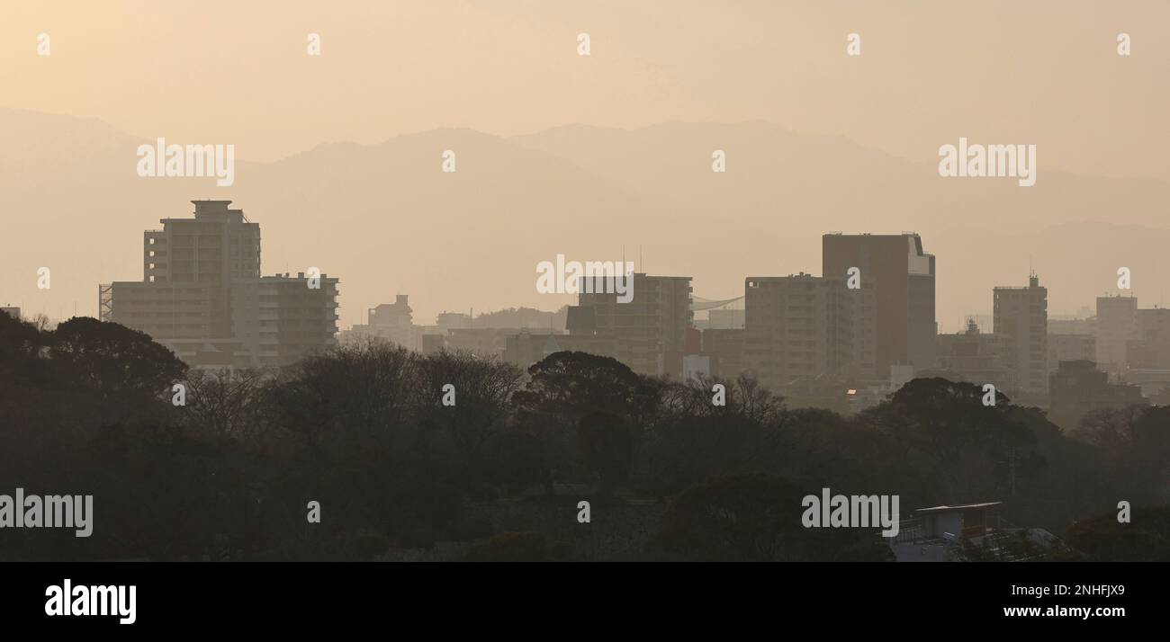 A photo shows yellow sand and air pollution covering the city of ...