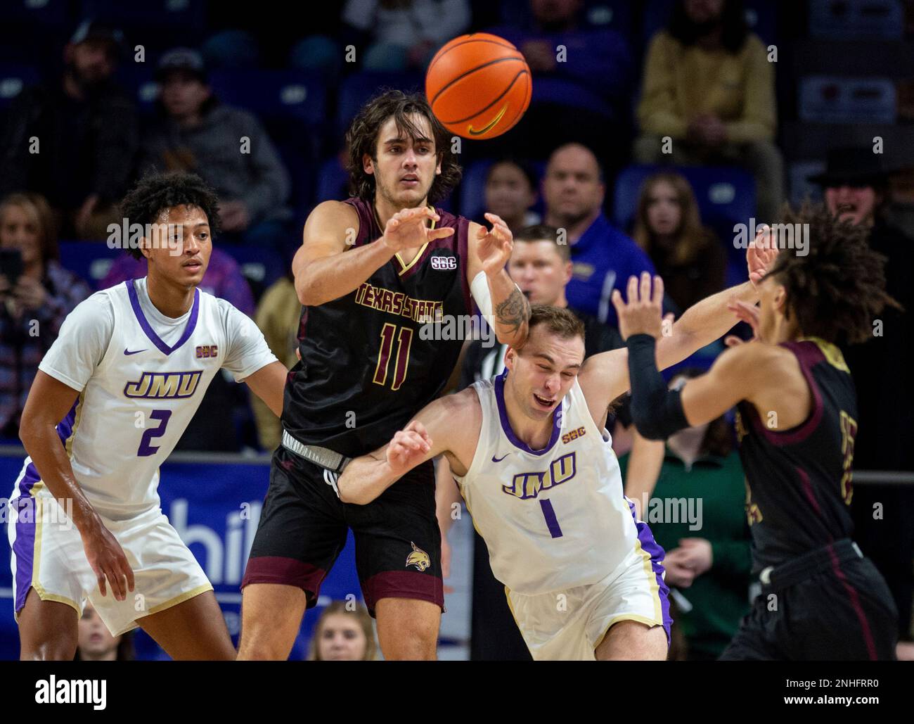 Texas State forward Nate Martin (11) passes the ball to guard Mason ...
