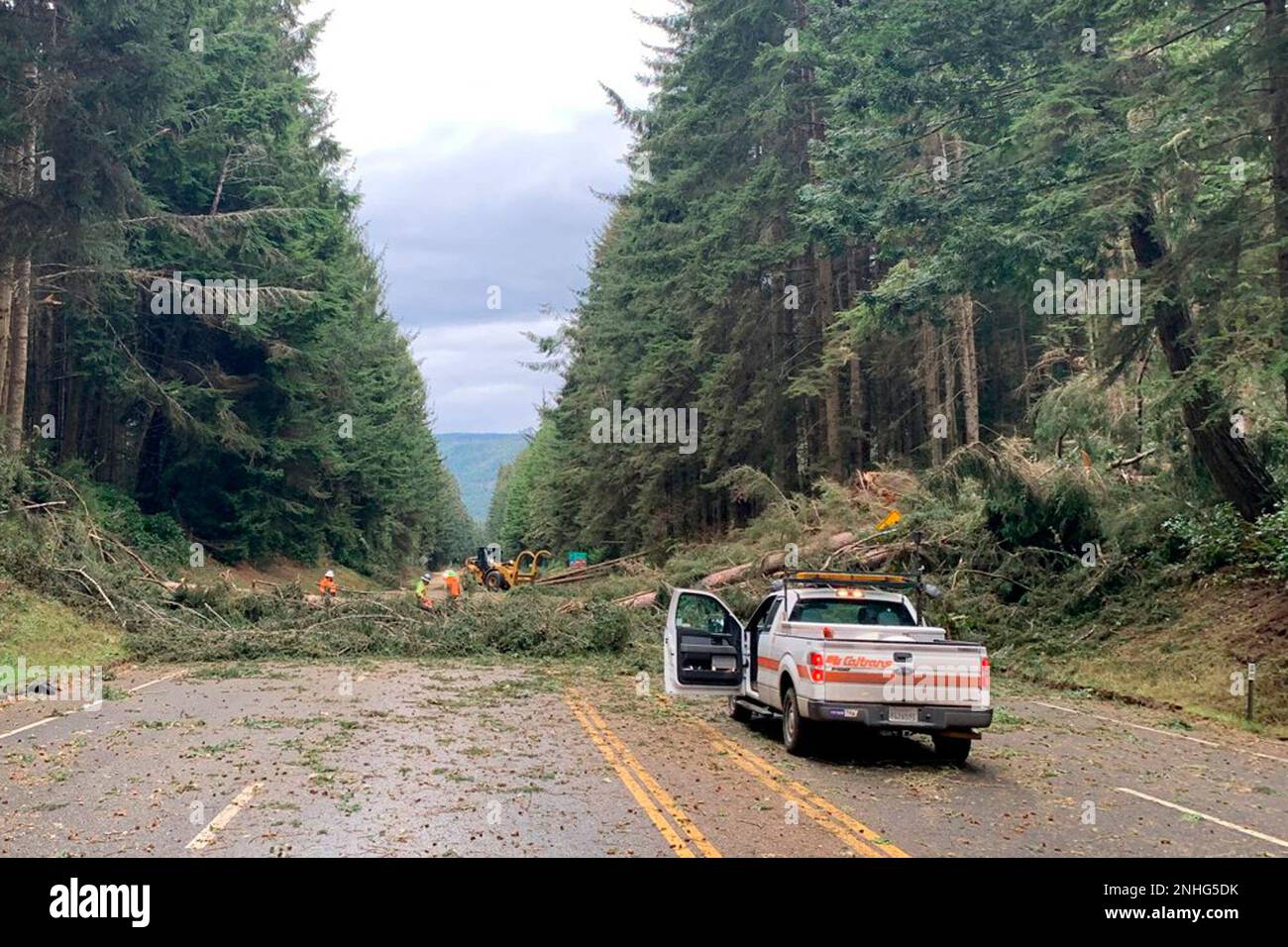 In this photo provided by Caltrans District 1, crews work at removing ...