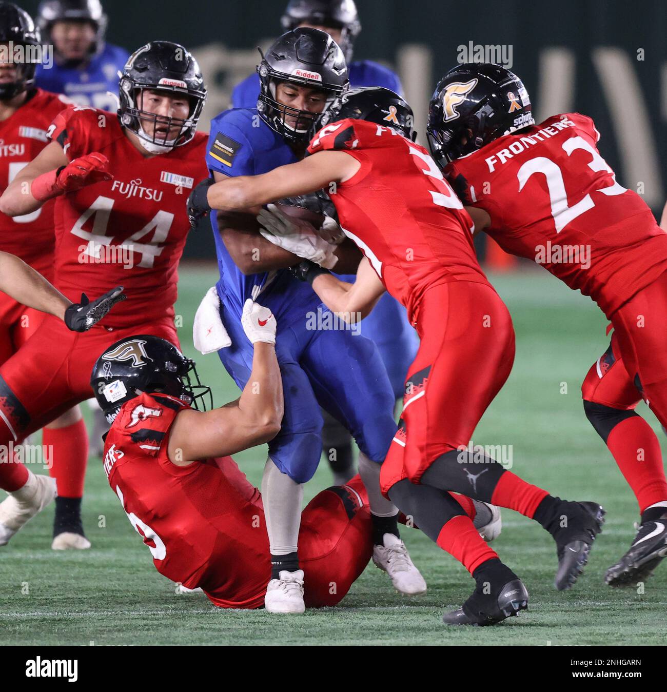 Victor Jamal Mitchell Jr (RB, C) of Panasonic Impulse is blocked during ...