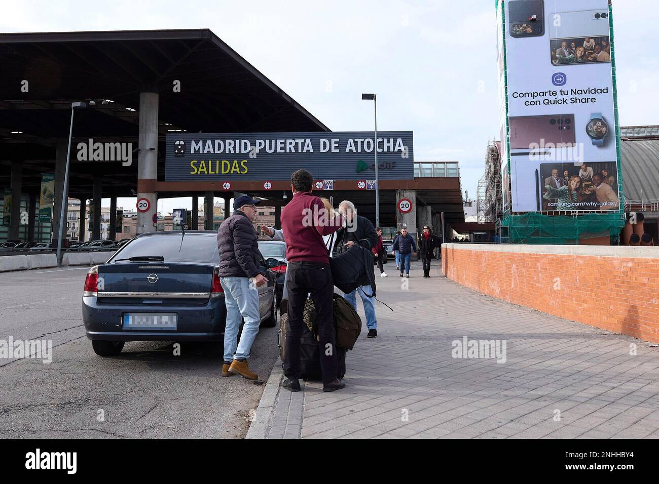 People drive into the Puerta de Atocha-Almudena Grandes station on December 30, 2022, in Madrid ...