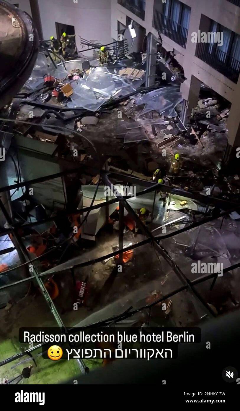 Following the burst of a huge aquarium, the atrium of a hotel is ...