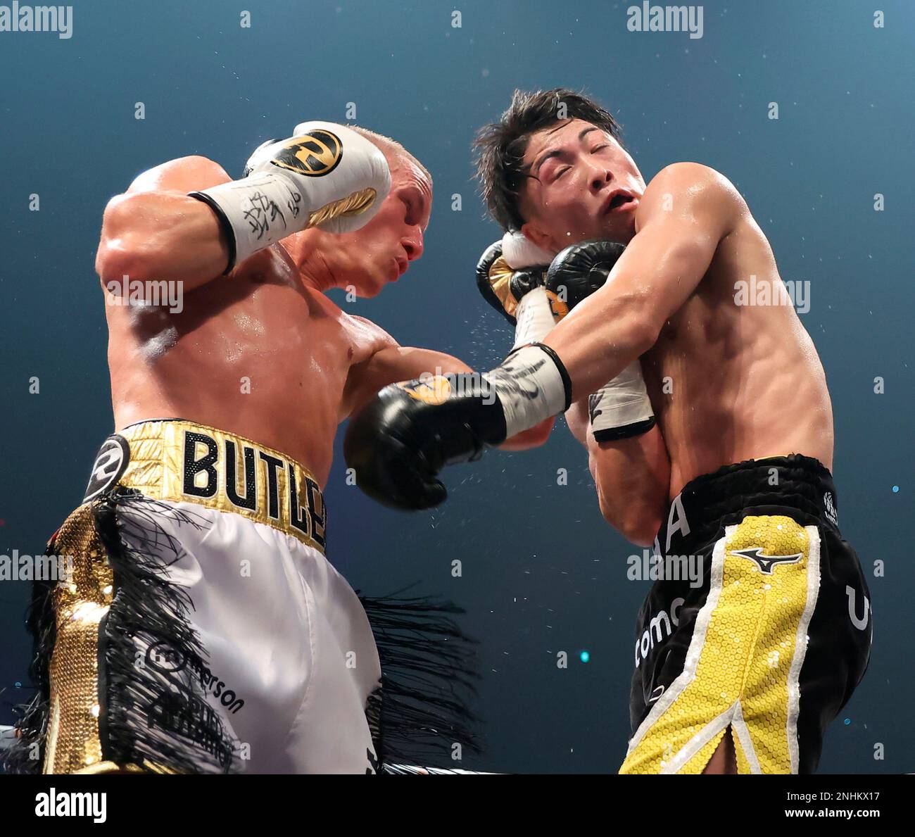 Naoya Inoue, Japanese three-division bantamweight champion, and British Paul Butler compete ...