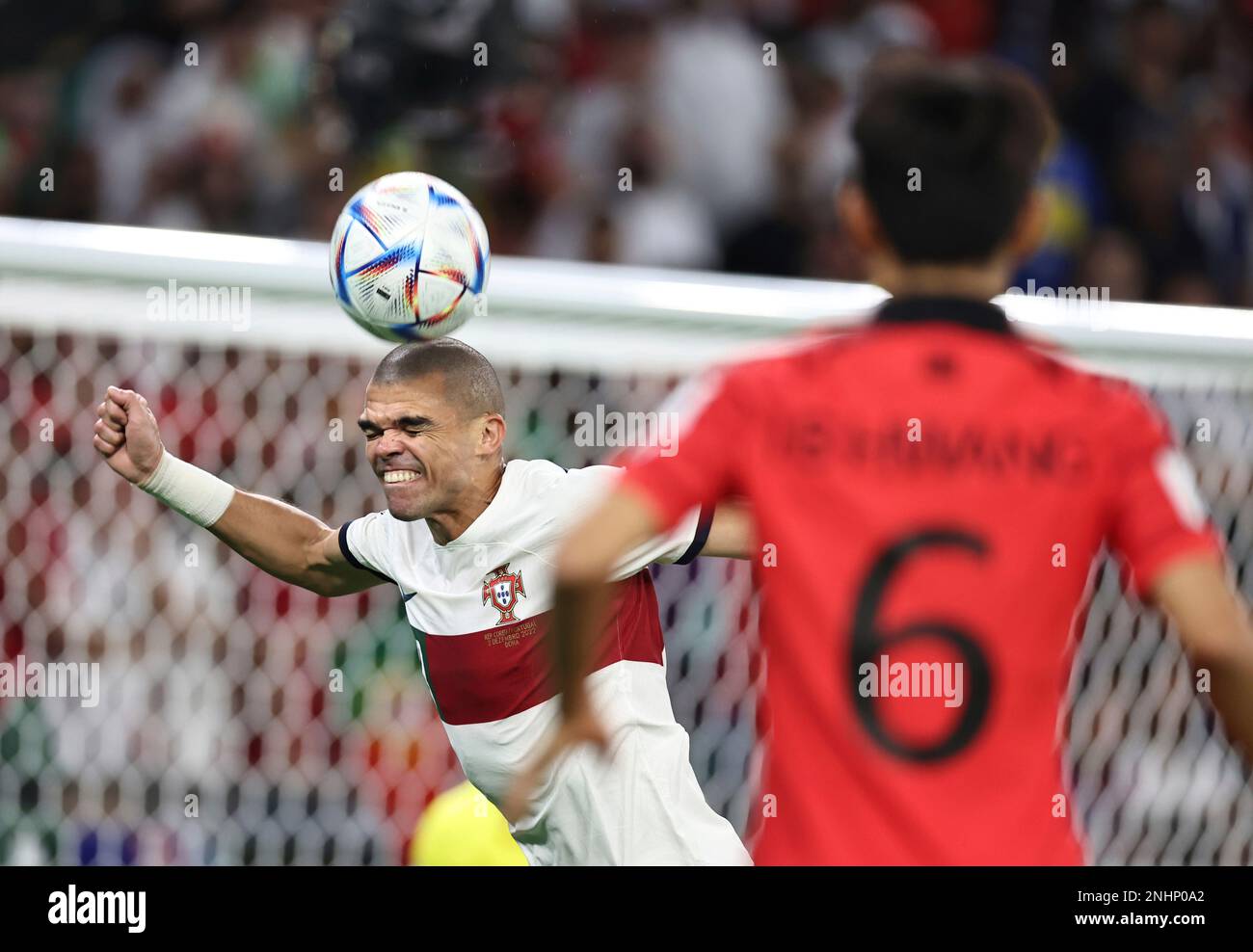 Portugal's Pepe (L) heads a ball during the Qatar 2022 World Cup Group ...