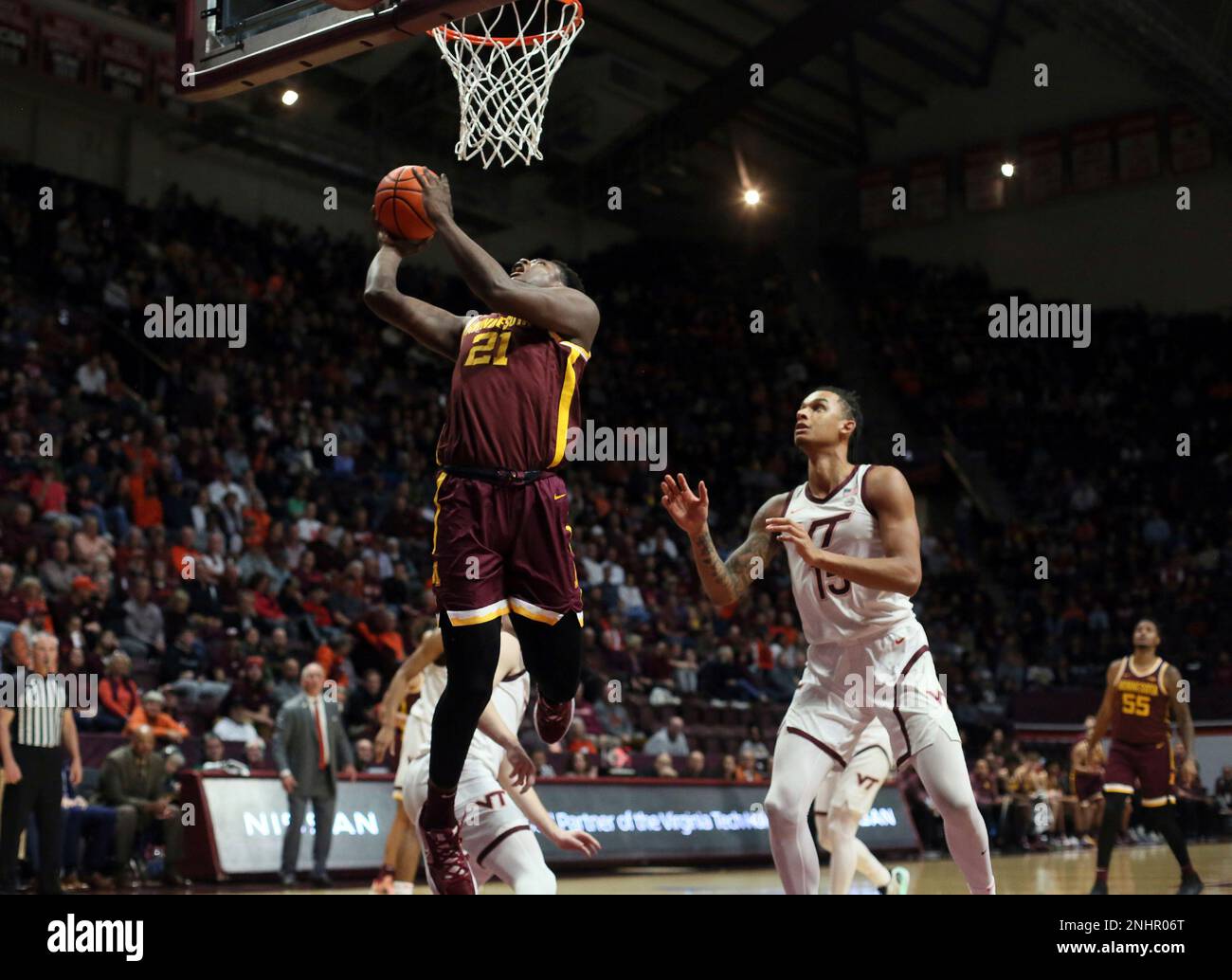 Minnesota's Pharrel Payne (21) scores past Virginia Tech's Lynn Kidd ...