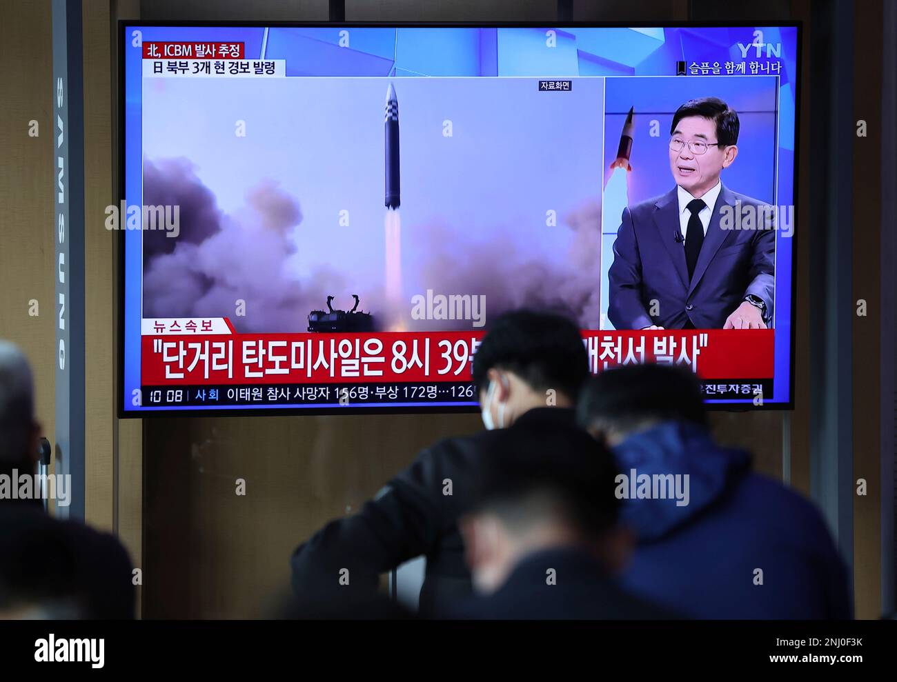 A TV monitor reports about North Korea's ballistic missile launches at Seoul Station in Seoul ...