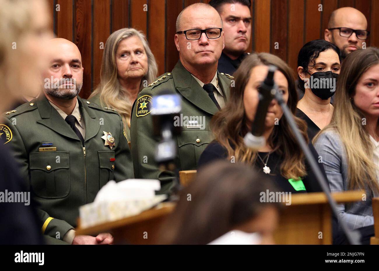 Santa Cruz County Sheriff Jim Hart, center, looks on during the ...