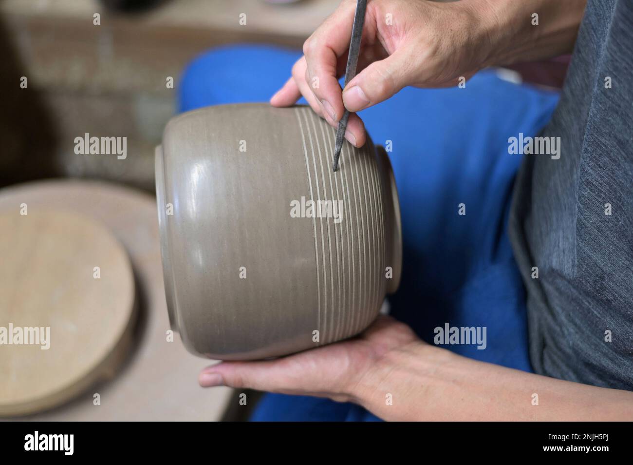 Doburo yakimonoshi (brazier maker and potter) Zengoro Eiraku makes a ...