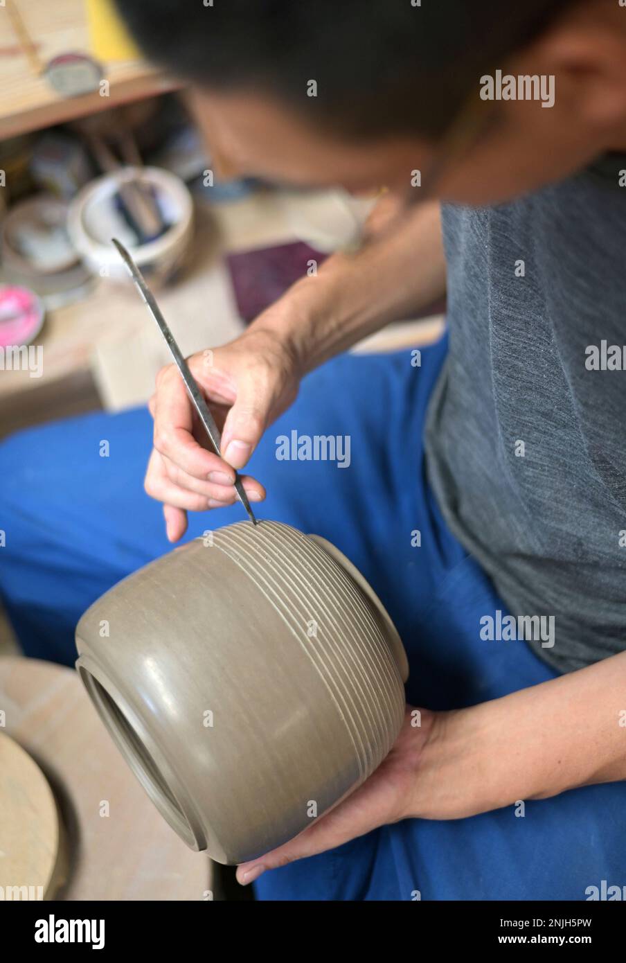 Doburo yakimonoshi (brazier maker and potter) Zengoro Eiraku makes a ...