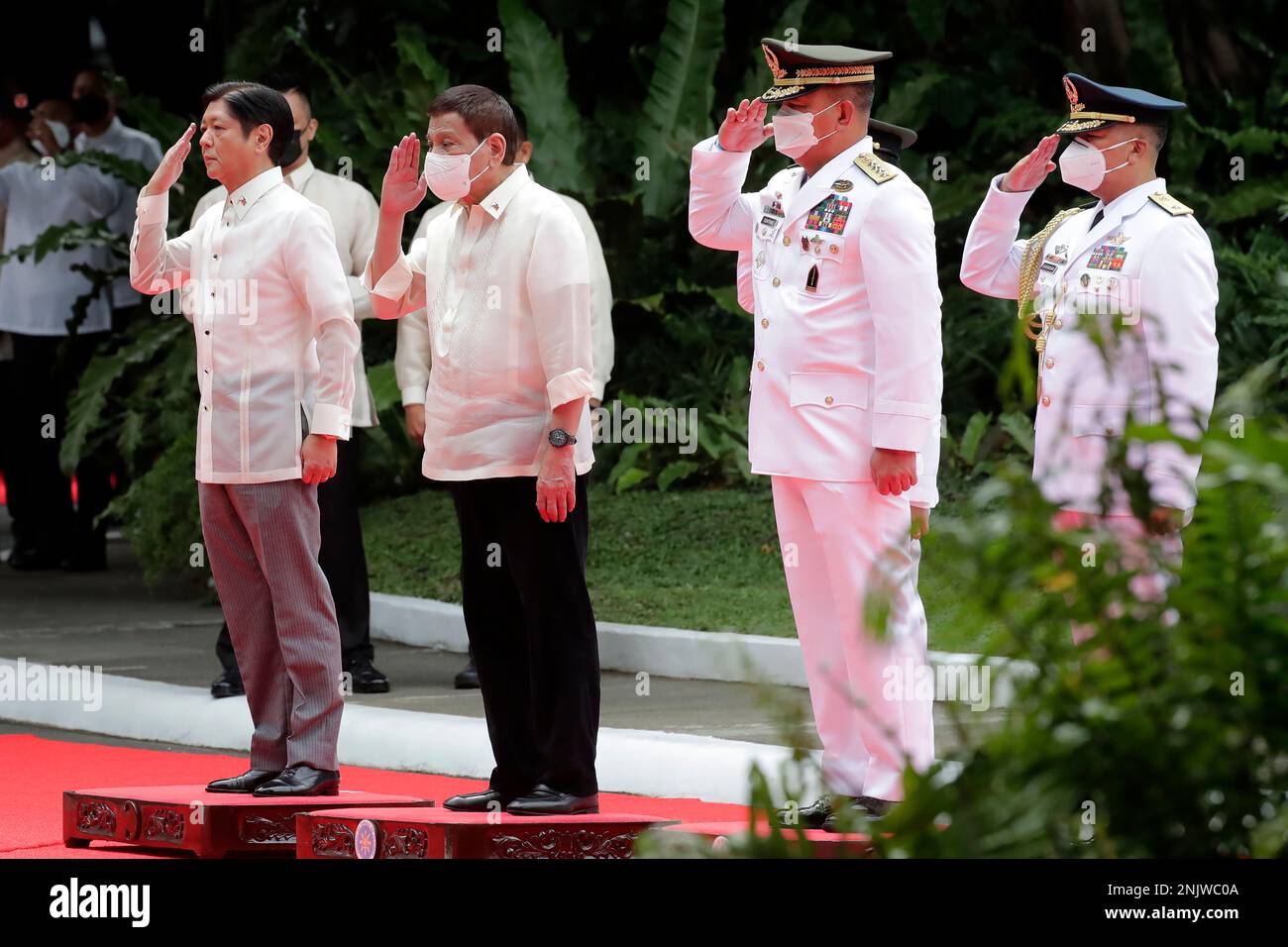 Incoming Philippine president Ferdinand Marcos Jr., left, and outgoing ...