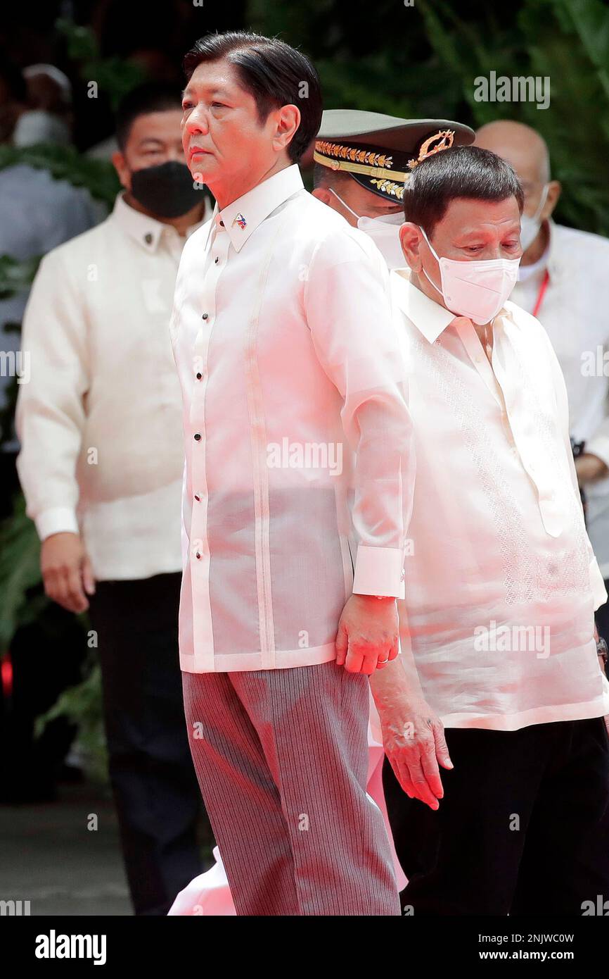 Incoming Philippine president Ferdinand Marcos Junior, left front, and ...