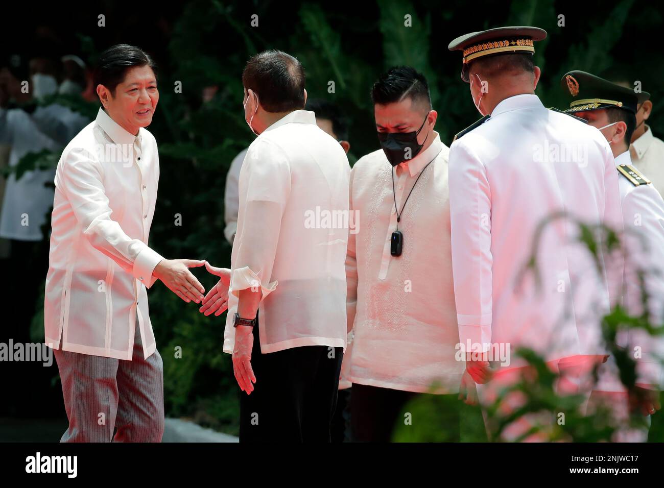 Incoming Philippine president Ferdinand Marcos Jr., left, and outgoing ...