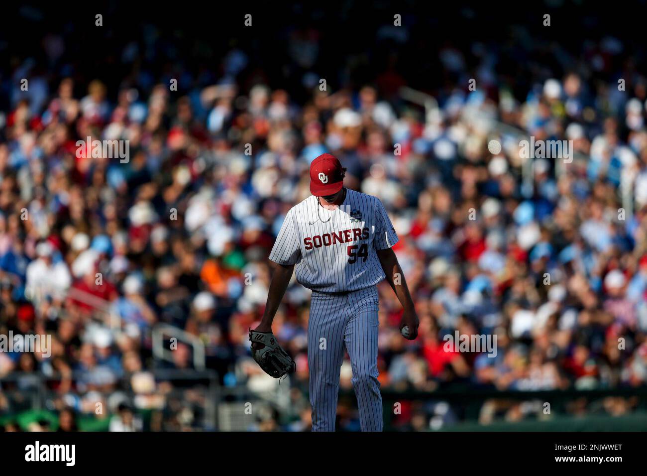 Oklahoma pitcher Jake Bennett (54) hangs his head after giving up a run ...