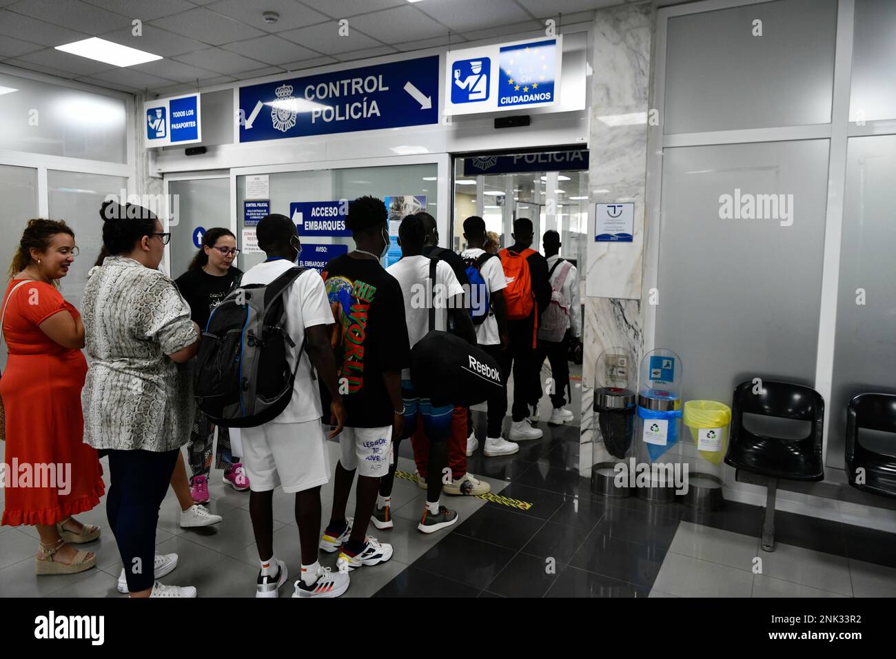Several migrants queue at the port of Ceuta to embark to the peninsula ...