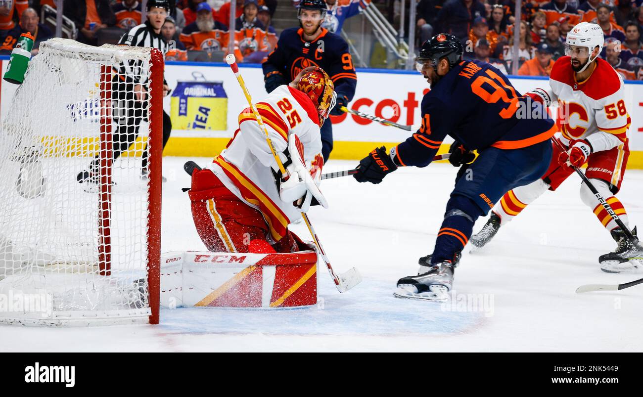 Calgary Flames goalie Jacob Markstrom, left, lets in a goal from ...