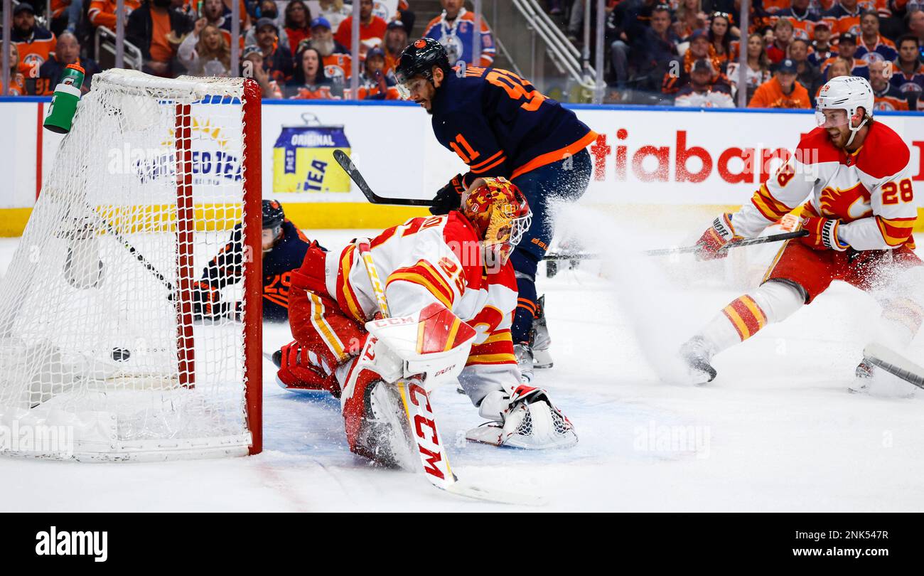 Calgary Flames goalie Jacob Markstrom, left, lets in a goal from ...