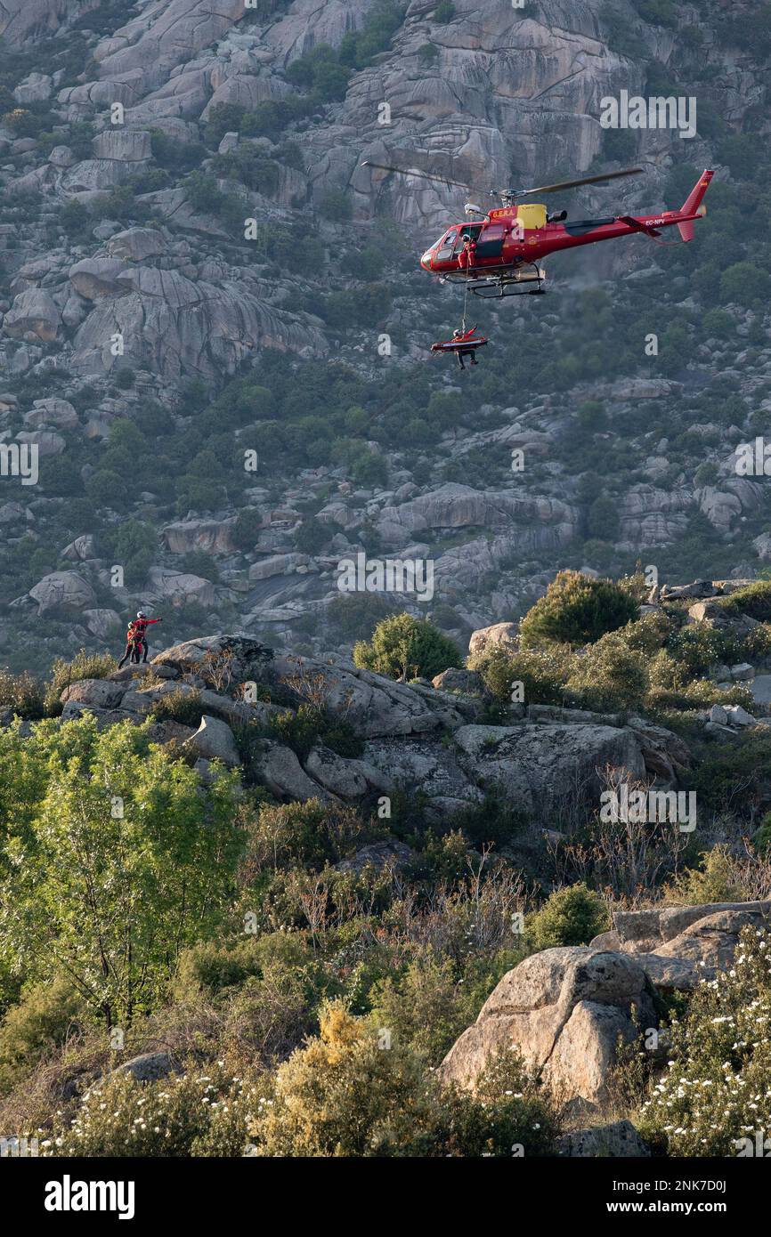 A firefighter descends a rope during a high altitude rescue exhibition ...