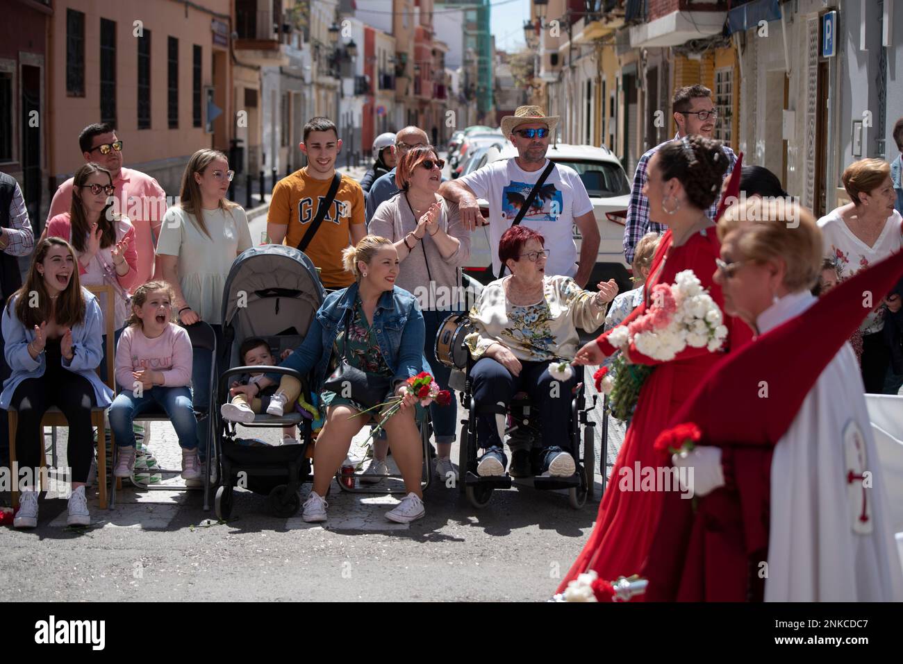 Several people watch the Easter Sunday parade of the Semana Santa ...