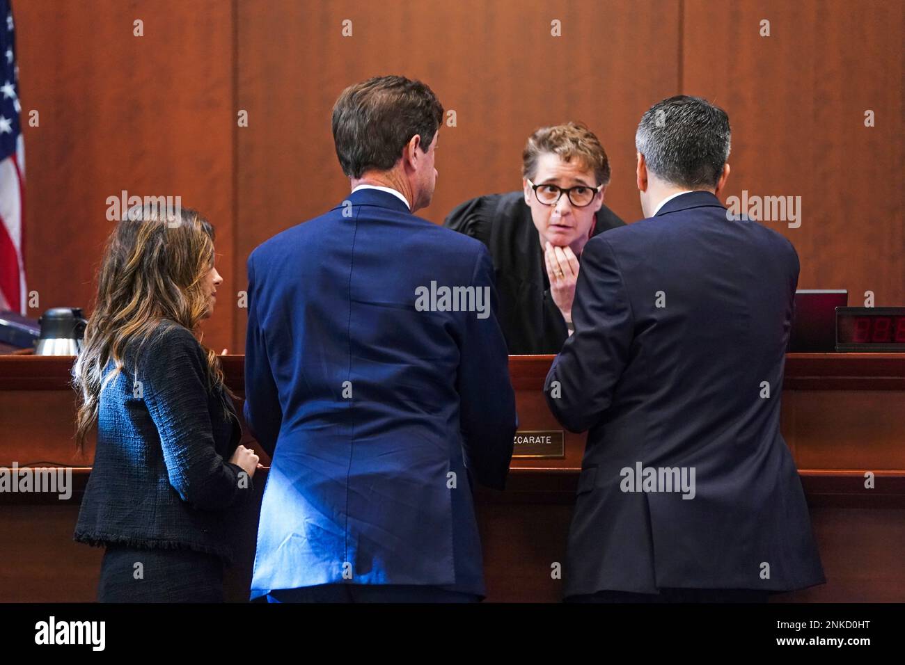 Judge Penney Azcarate speaks with lawyers in the courtroom at the ...