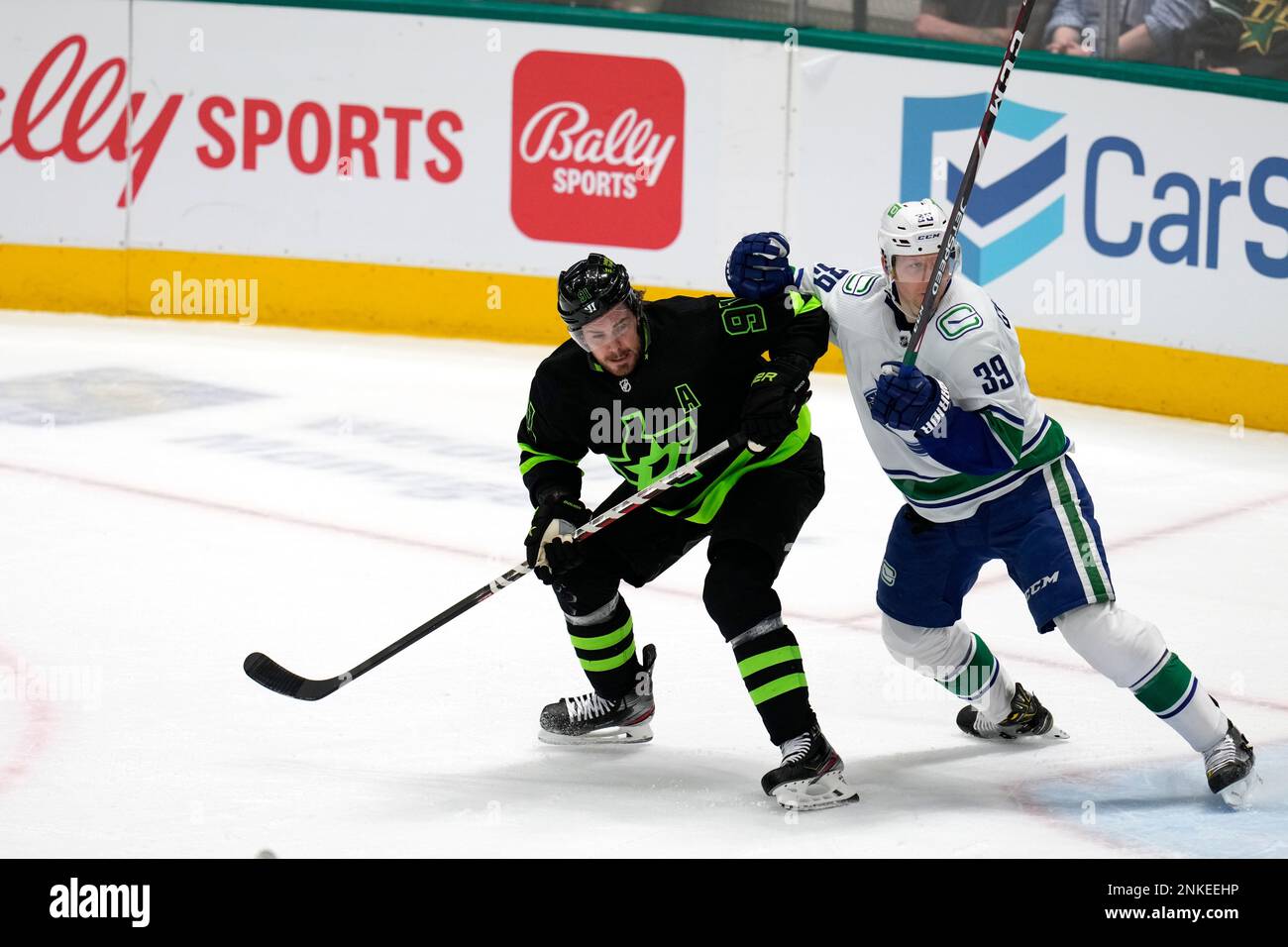 Vancouver Canucks right winger Alex Chiasson (39) checks Dallas Stars ...