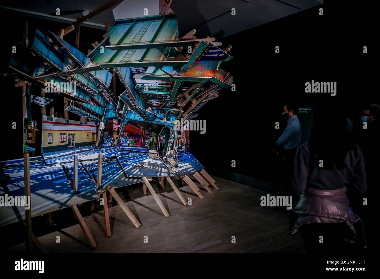 Visitors contemplate the works that are part of the exhibition ...