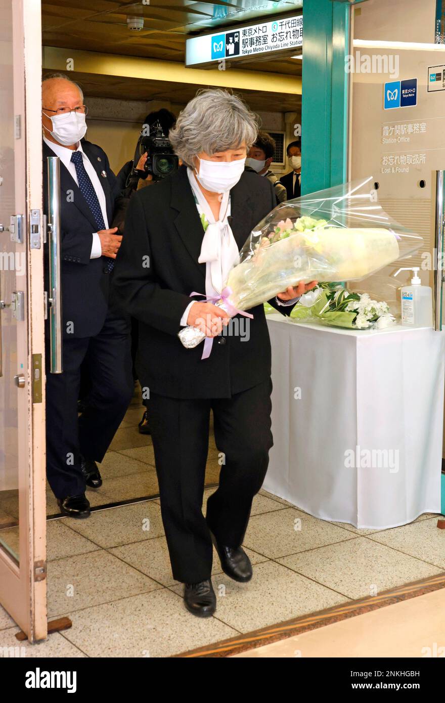 Shizue Takahashi, offers the flowers at the temporary altar for the ...