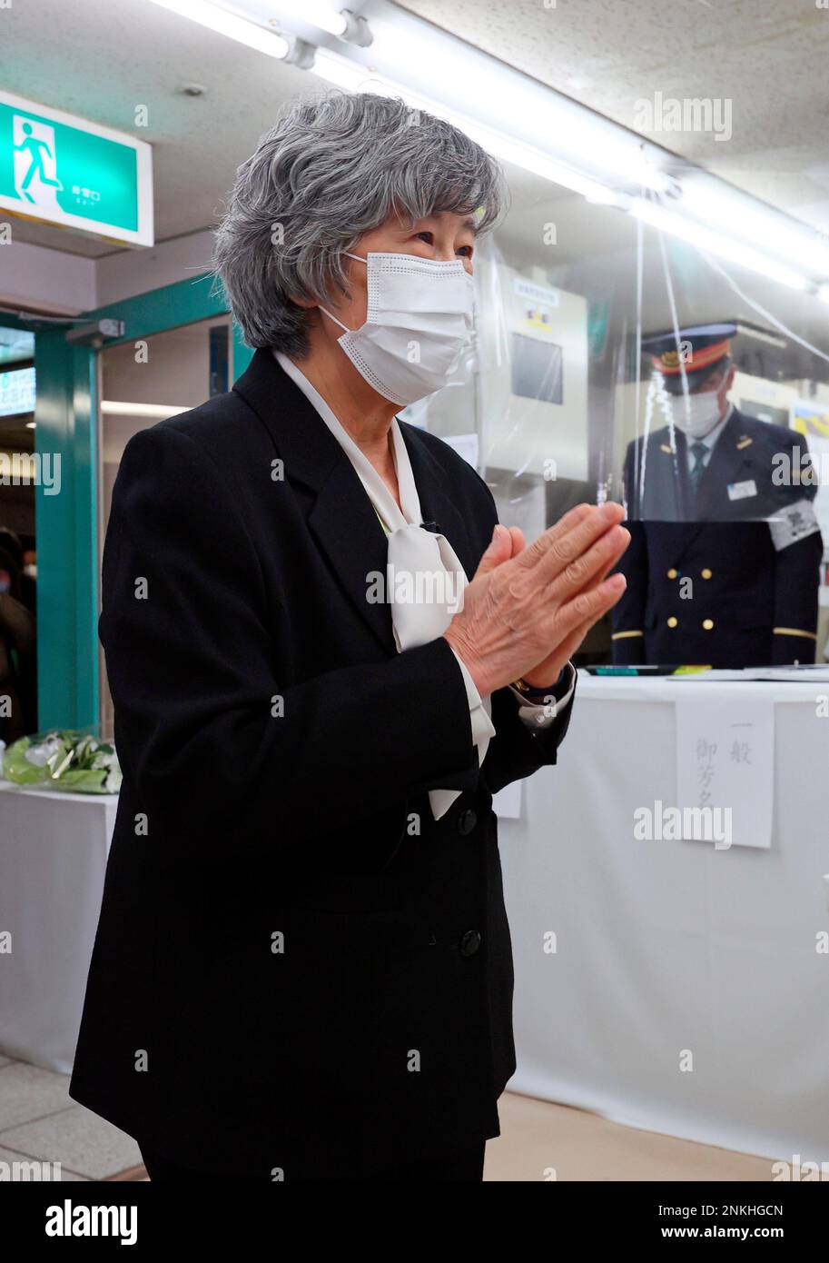 Shizue Takahashi, offers the flowers at the temporary altar for the ...