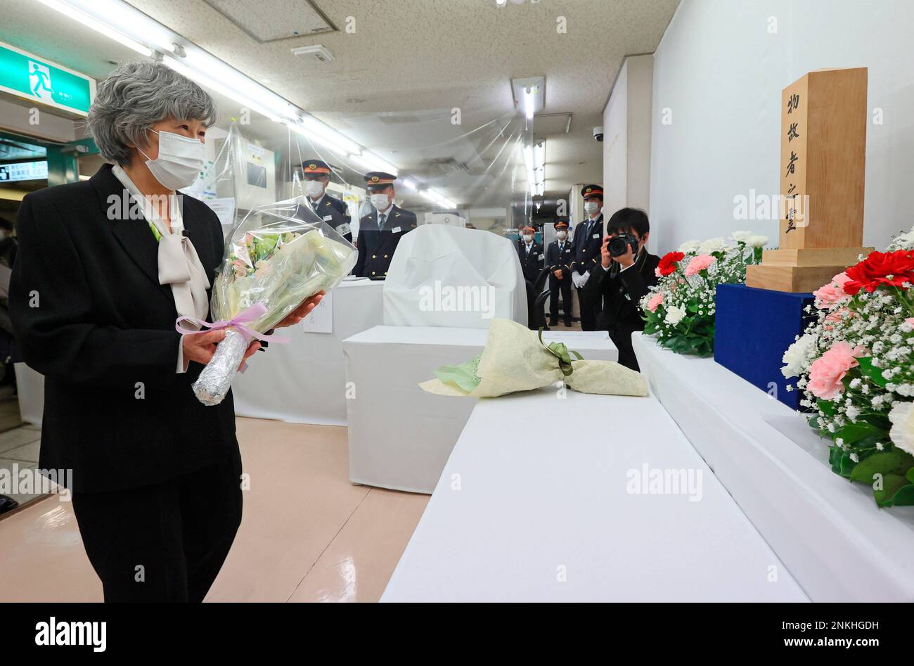 Shizue Takahashi, offers the flowers at the temporary altar for the ...
