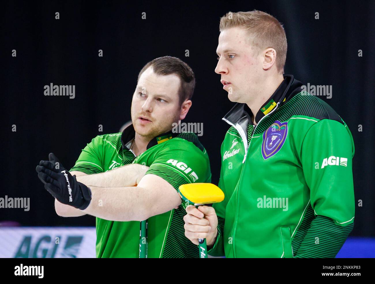 Team Saskatchewan skip Colton Flasch, right, and third Catlin Schneider ...