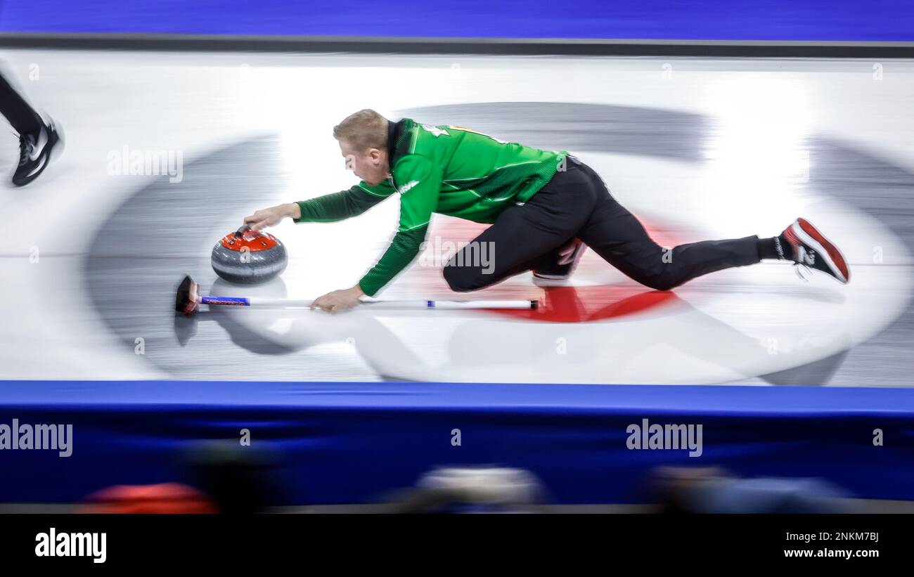 Team Saskatchewan skip Colton Flasch makes a shot while playing Team ...