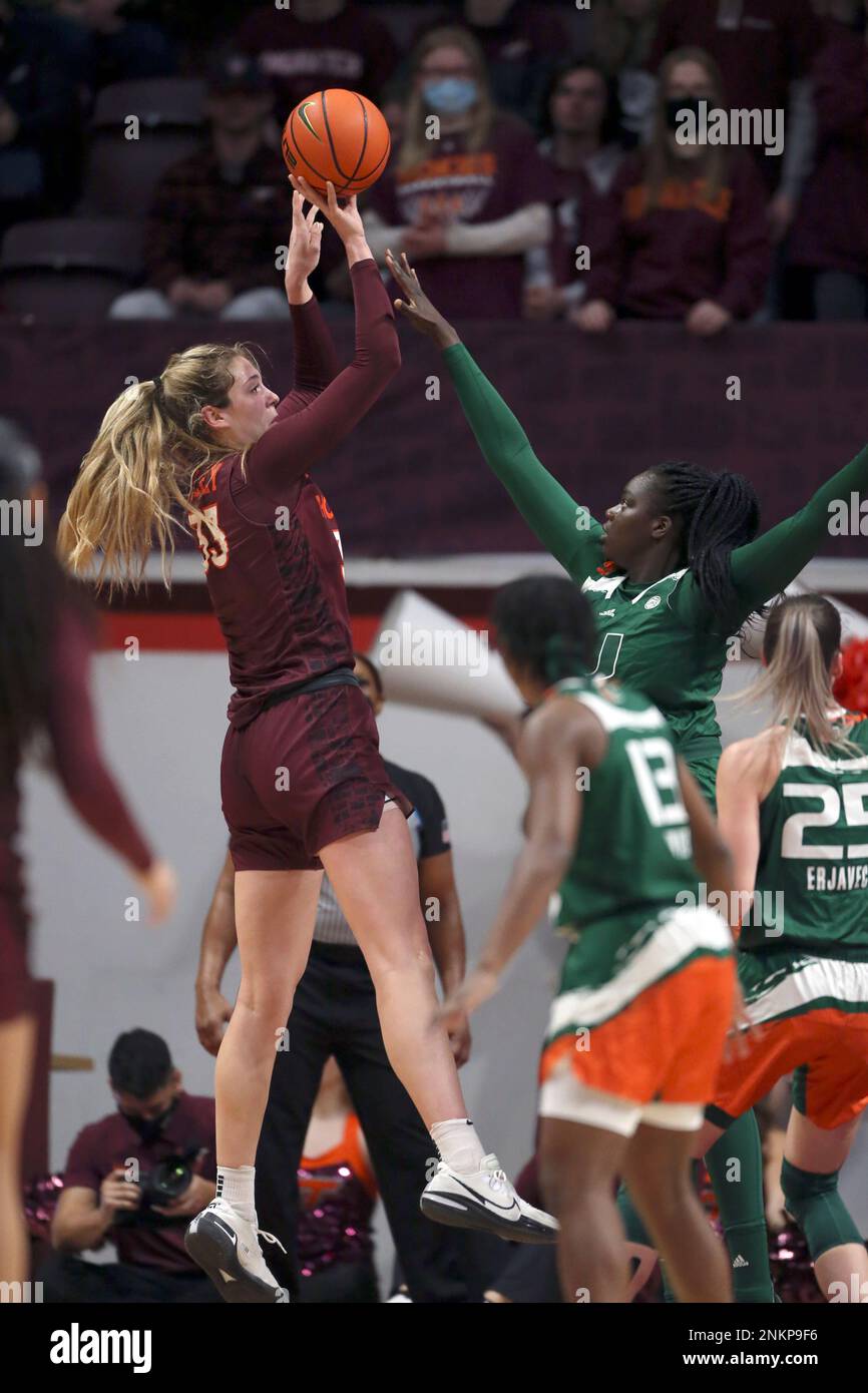 Virginia Tech's Elizabeth Kitley (33) shoots over Miami defenders ...
