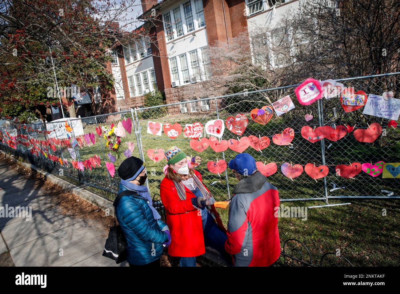 Julie Crowder, an Arts teacher at Fox Elementary School, center, chats ...