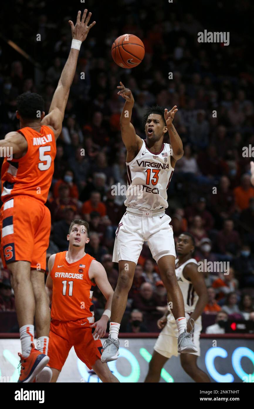 Virginia Tech's Darius Maddox (13) passes the ball past Syracuse's ...