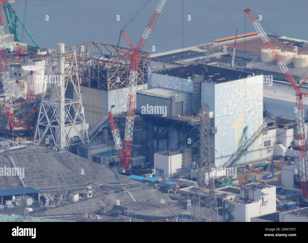 An aerial photo shows Unit 1 (L), 2 of the Fukushima No. 1 Nuclear ...