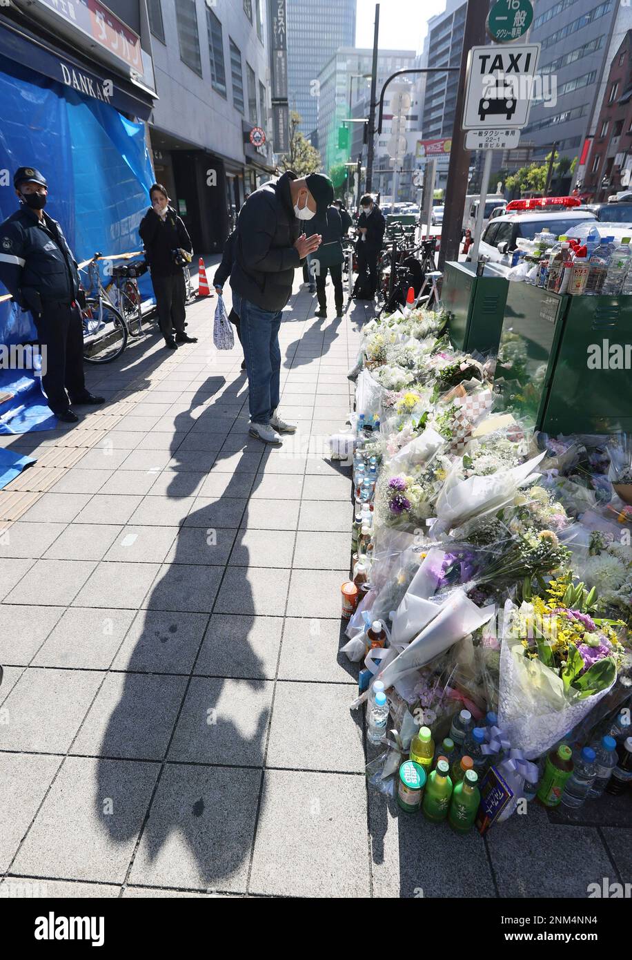 People mourn the victims in front of the fire site in Osaka City, Osaka ...