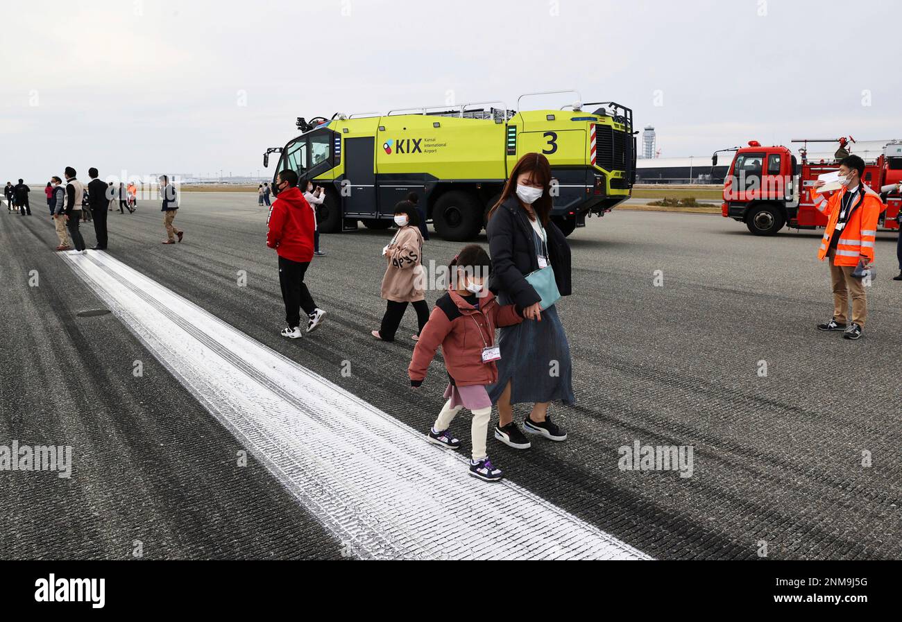 Participants walk on Runway A during an event "KIX Runway Walk" at ...