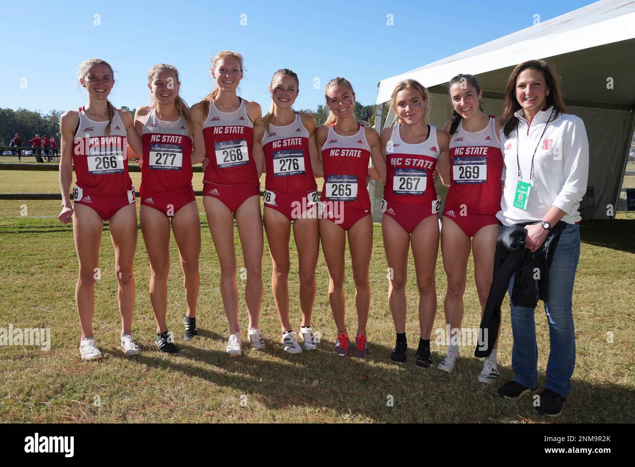Members of the NC State women's team pose with coach Laurie Henes after ...