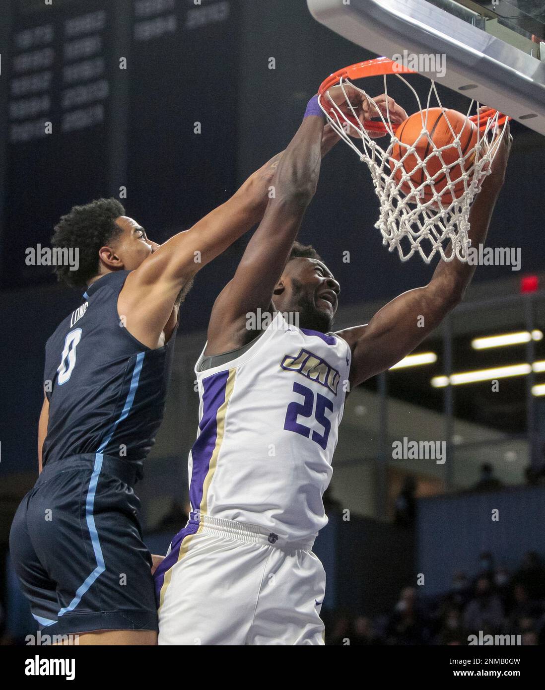 James Madison forward Alonzo Sule (25) drives in a slam dunk against ...