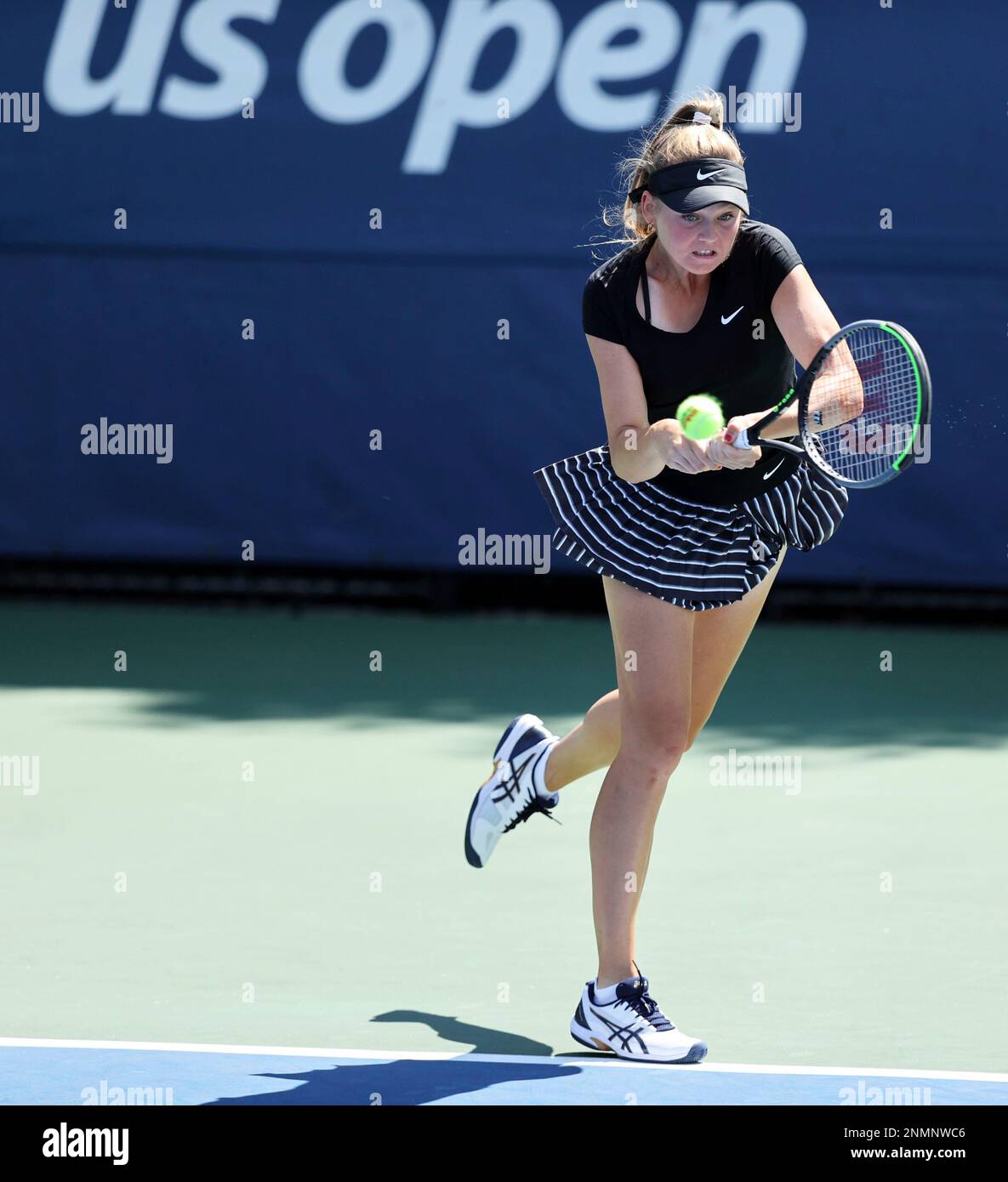 Linda Klimovicova returns a shot during a Junior Girls' Singles match ...
