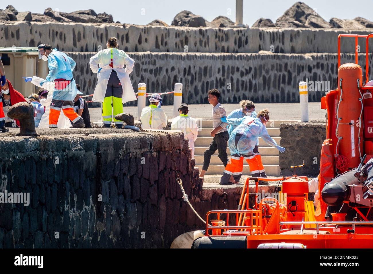 One of the 34 migrants travelling on the skiff, on their arrival at La ...