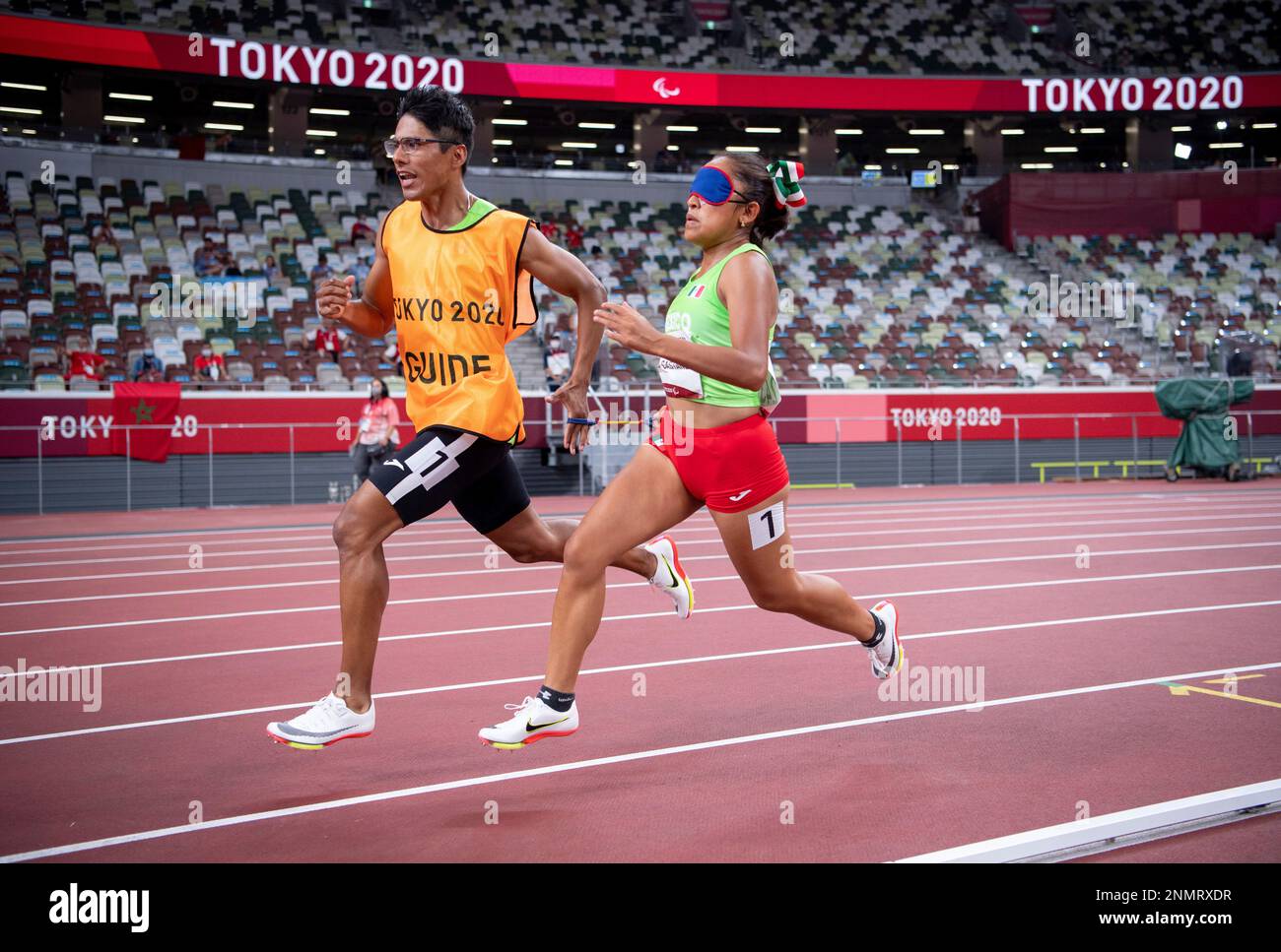 Diana Laura Coraza Castaneda of Mexico competes with her guide Jorge ...
