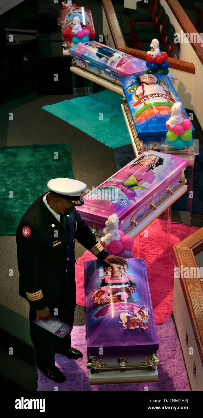 East St. Louis assistant fire chief George McClellan rests his hand on ...